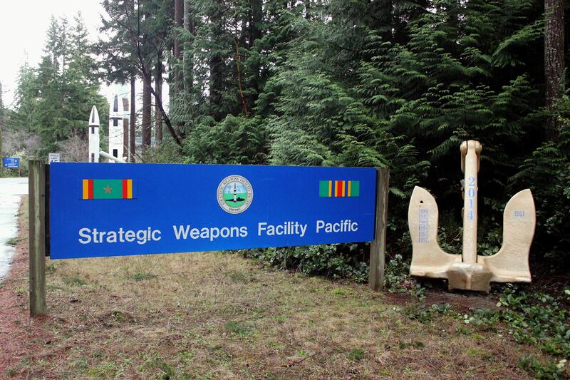 Harbor security boat strikes barrier and sinks, injuring three sailors